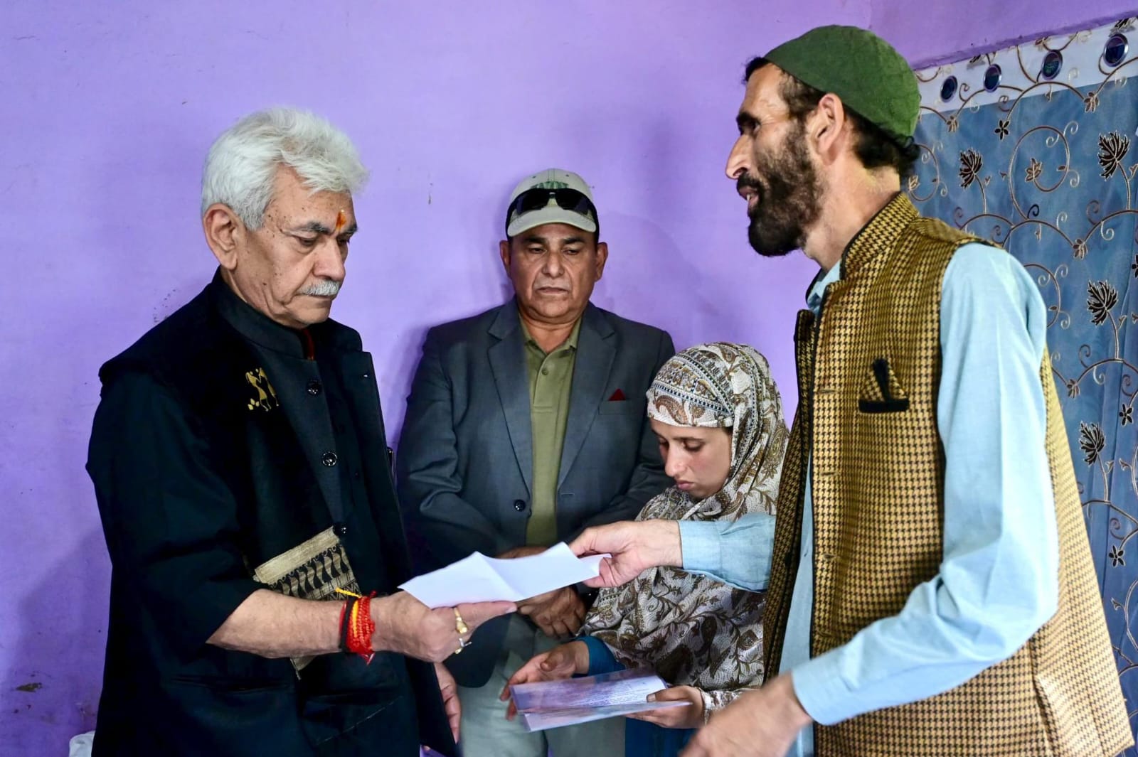 LG Manoj Sinha Visits Family of Pahalgam Attack Victim, Hands Over Job ...